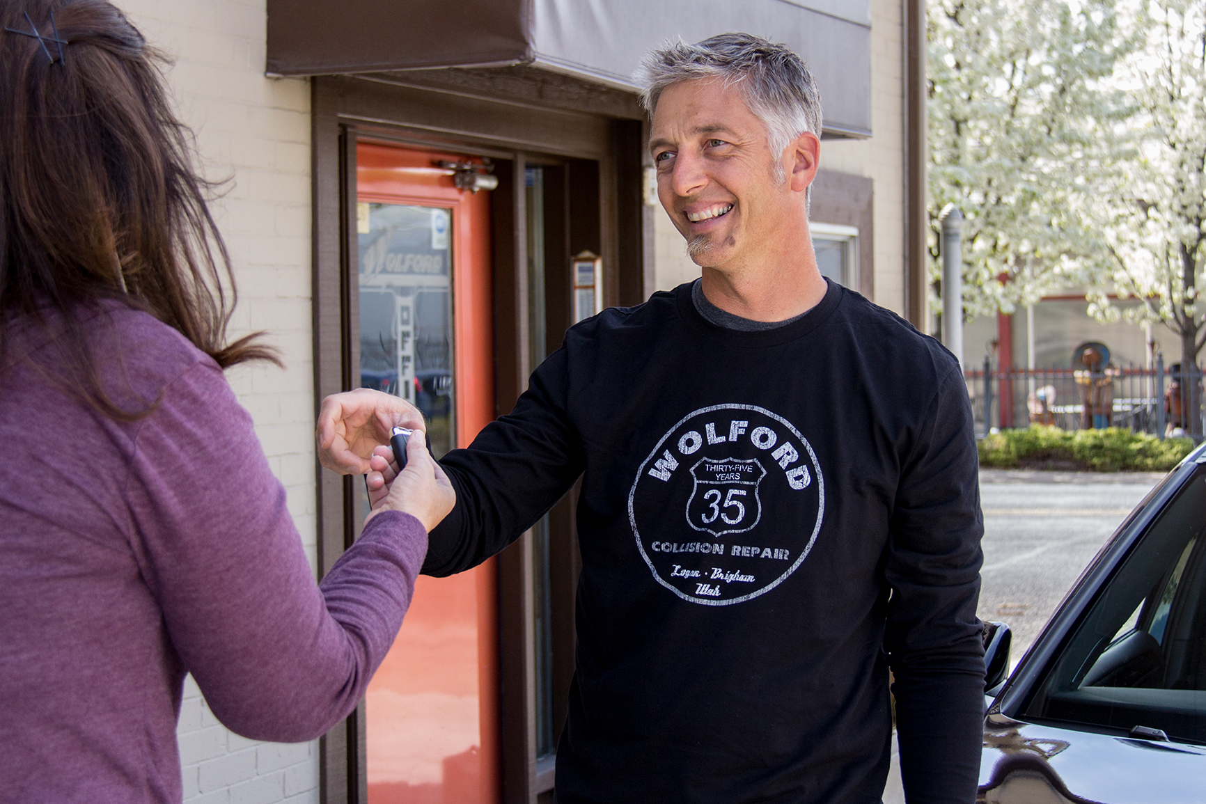 Tim Wolford Handing Off Car Keys - Wolford Collision Repair